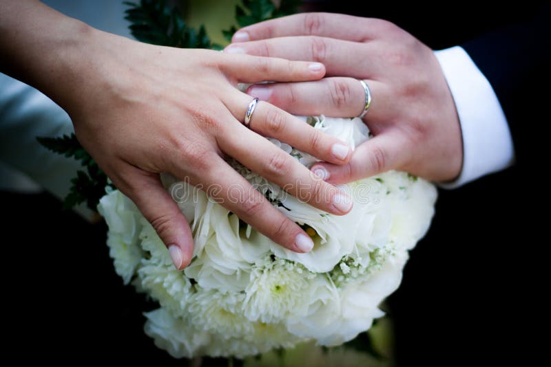 Wedding Ring Over the Bridal Bouquet Stock Photo - Image of bridal ...