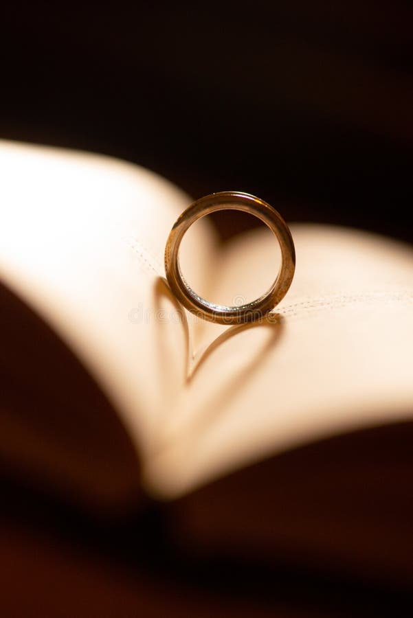 Wedding ring on the pages stock image. Image of romance - 343607533