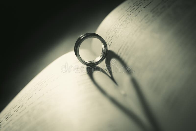 Wedding ring on the pages stock image. Image of celebration - 343607681