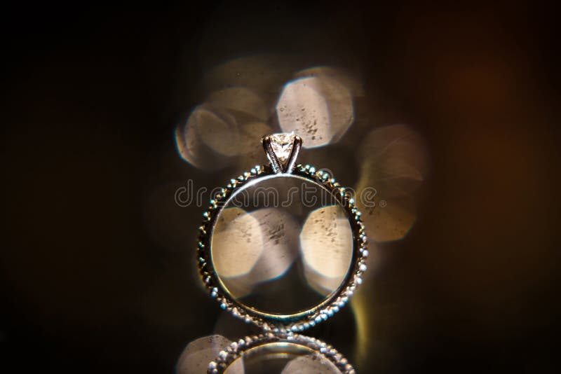 Wedding Ring on the Reflecting Surface with Highlights Stock Image ...