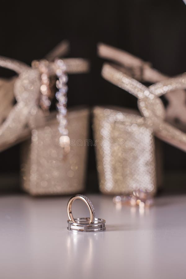 Wedding Ring with Shoes and Nice Flowers Editorial Photography - Image ...