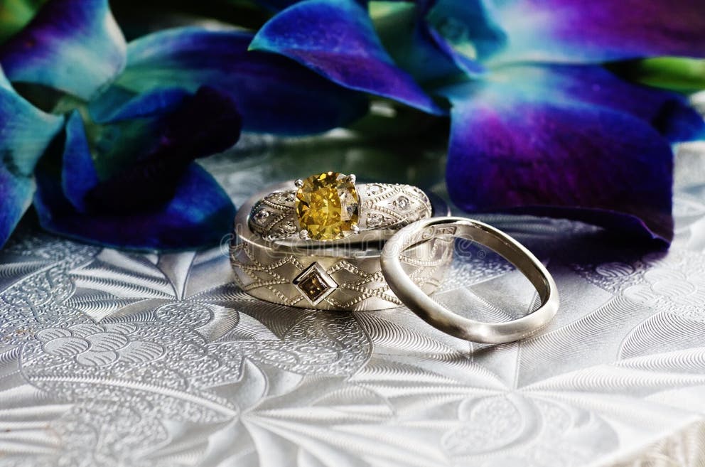 Jewelry:Wedding Rings, Flowers, Brocade Table Clot Stock Photo - Image ...