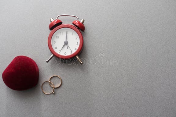 Wedding Rings and Alarm Clock, Wedding Time Concept. Stock Image ...