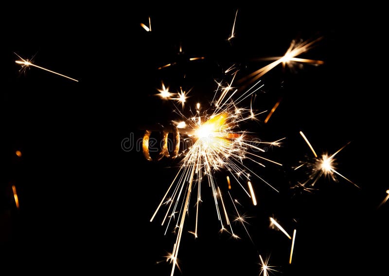 Wedding Rings on a Black Background with Burning Bingala Lights. Dark ...
