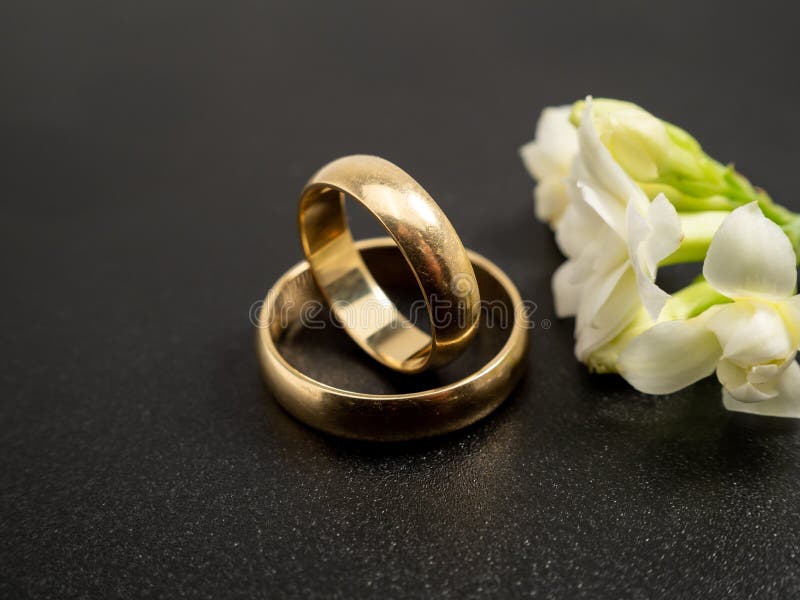 Wedding Rings on a Black Background. Gold Rings Stock Photo - Image of ...