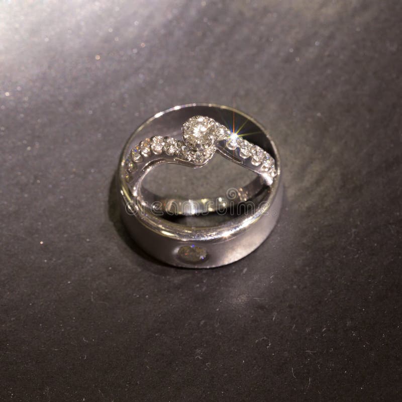 Wedding Rings on the Black Marble Stone. Stock Photo - Image of ...