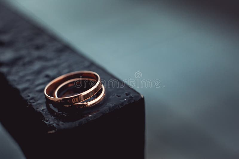Wedding Rings on a Black Metal Stock Image - Image of luxury, metal ...