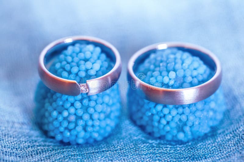 Wedding Rings on Blue Candies Stock Image - Image of beautiful, white ...