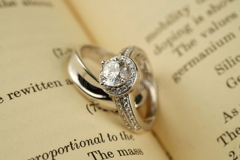 Wedding rings on book stock image. Image of arrangement - 67452009