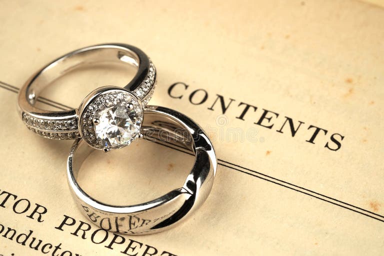 Wedding rings on book stock image. Image of bride, happy - 67452147