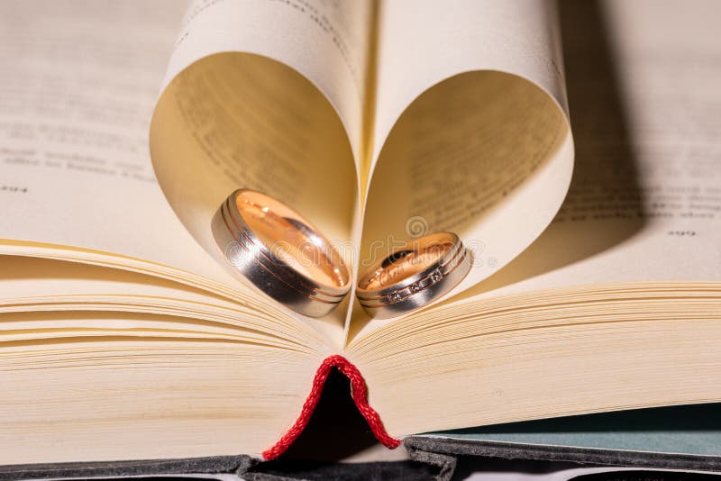 Closeup Shot of Weddings Rings between the Pages of a Book Stock Image ...