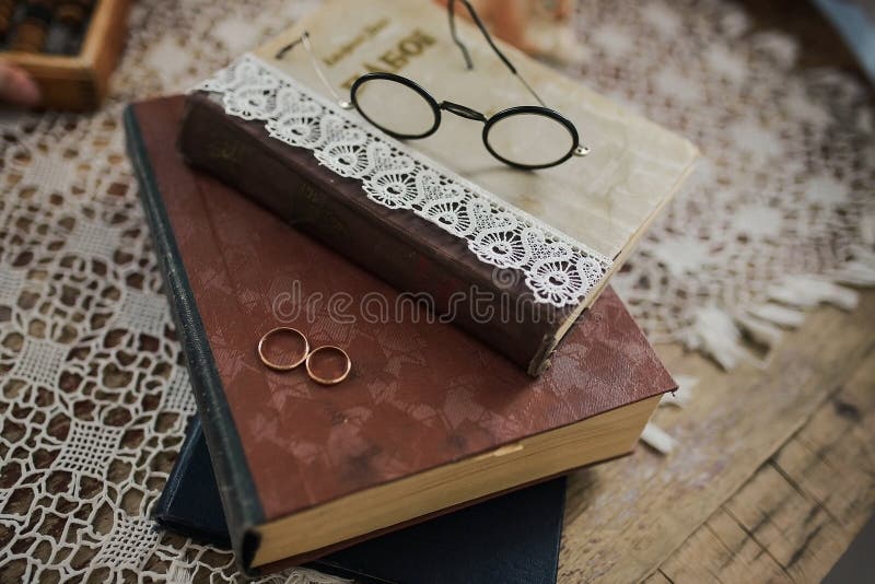 Wedding rings on the book stock image. Image of page - 88317577