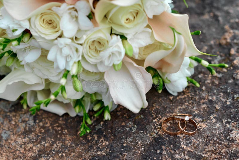 Wedding rings and bouquet stock image. Image of love - 262245503