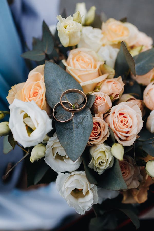 Wedding Rings in a Bouquet of the Bride. Bouquet of Roses Stock Image ...