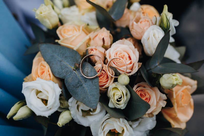 Wedding Rings in a Bouquet of the Bride. Bouquet of Roses Stock Photo ...