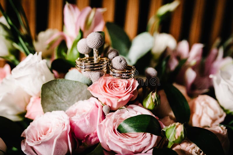 Wedding Rings on a Bouquet of Flowers from Roses Stock Image - Image of ...