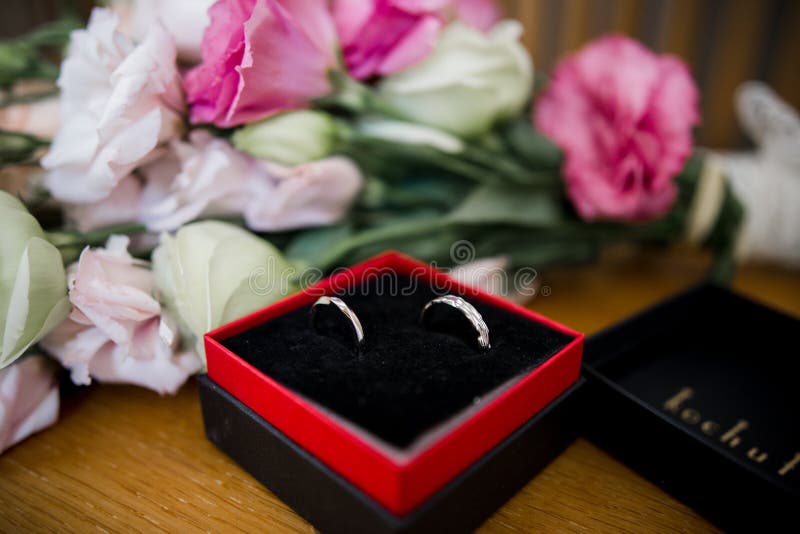 Wedding Rings in a Box with Flowers Stock Photo - Image of decoration ...