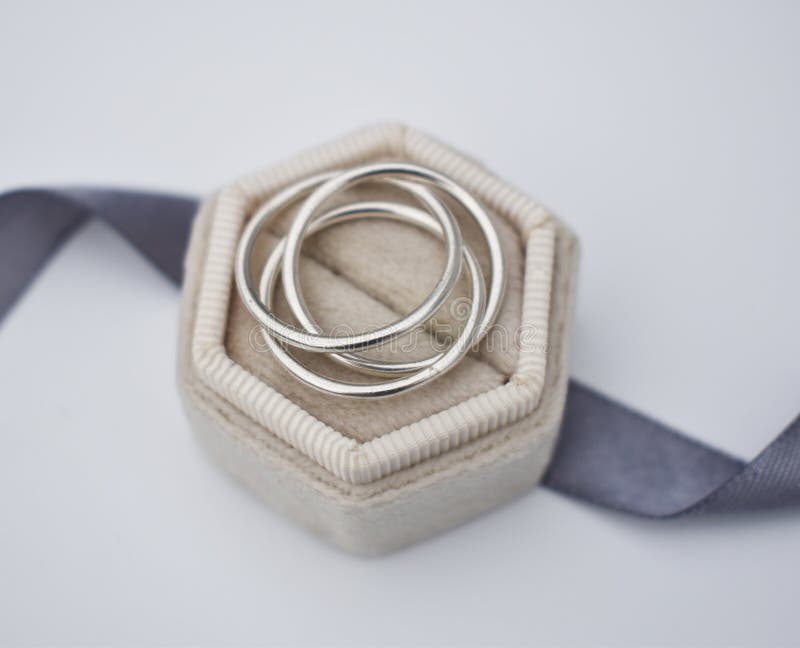 Wedding Rings in a Box with a Ribbon on a White Background Stock Photo ...