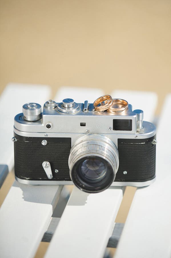 Wedding Rings on Camera stock photo. Image of camera - 69931216
