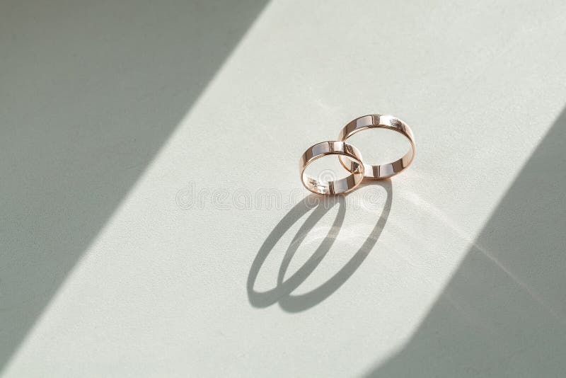 Wedding Rings on Wedding Card on a White Background, Two Golden Wedding ...