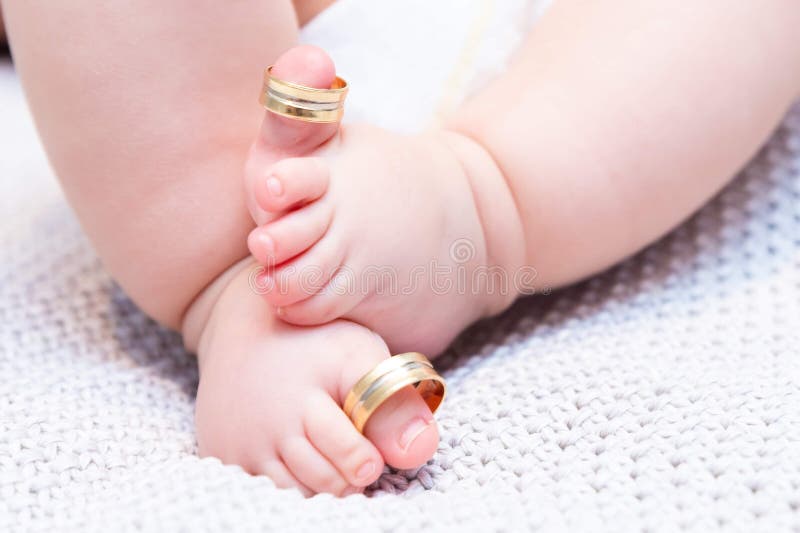Wedding Rings on Child Finger Stock Photo - Image of toes, finger ...
