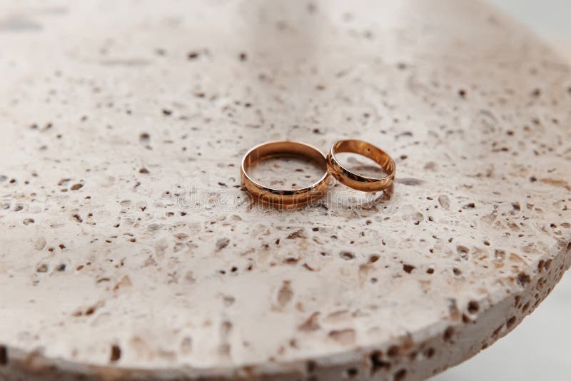 Wedding Rings on Gypsum Texture on the Stone Table. Stock Image - Image ...
