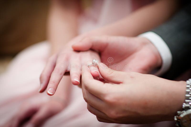 Wedding rings exchange stock photo. Image of pastel, family - 42131276