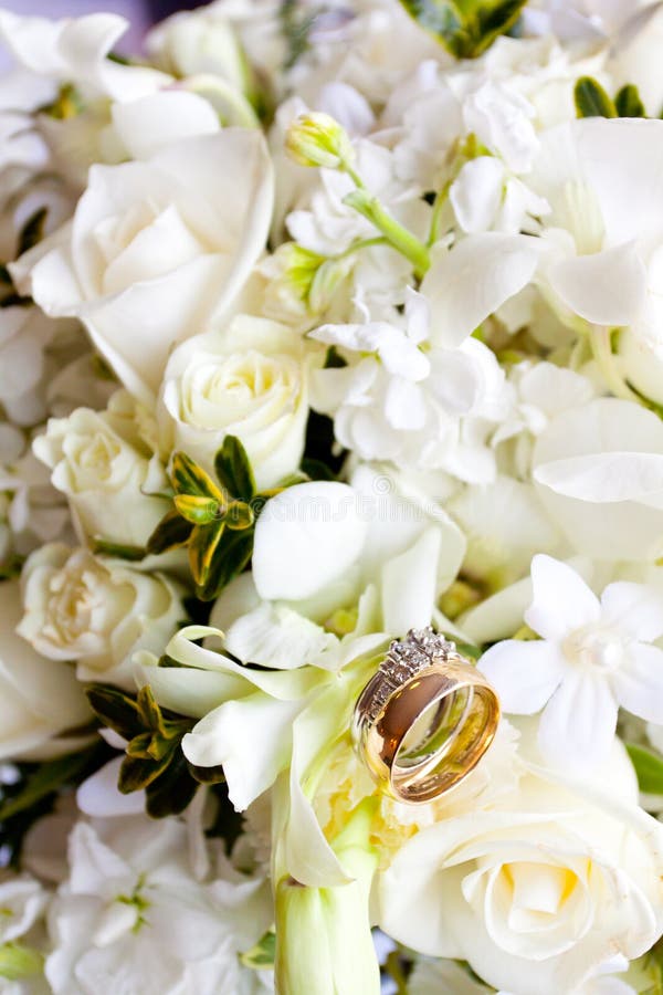 Wedding Rings on Flowers stock image. Image of flower - 27459961