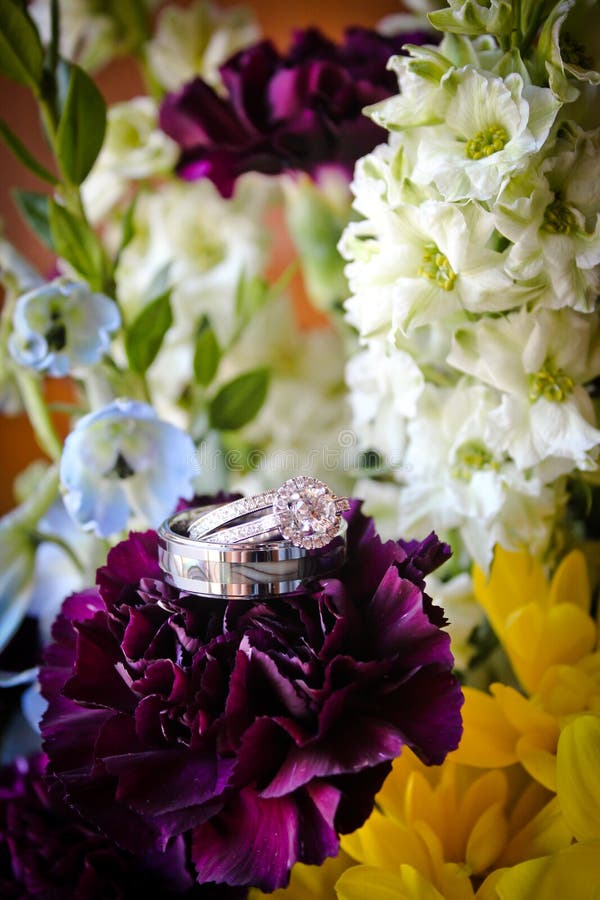 Wedding Rings on Flowers stock photo. Image of pearl - 36030002