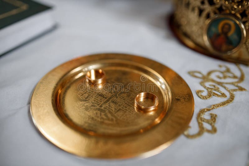 Wedding Rings on a Gold Plate Stock Photo - Image of table, elegant ...