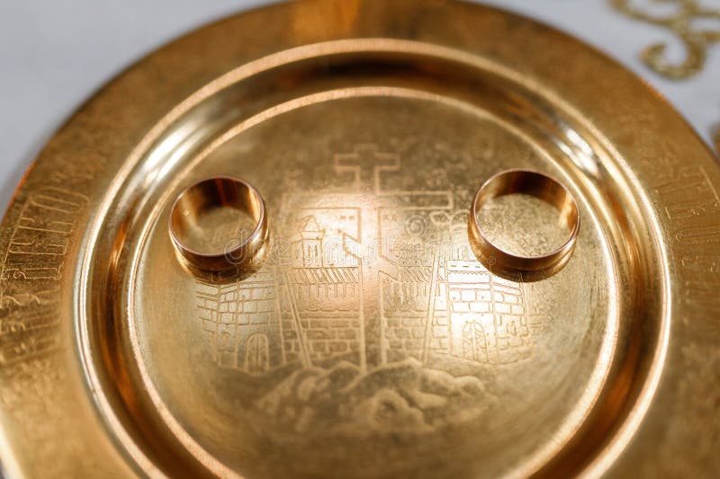 Wedding Rings on a Gold Plate Stock Photo - Image of chair, menu: 315138154