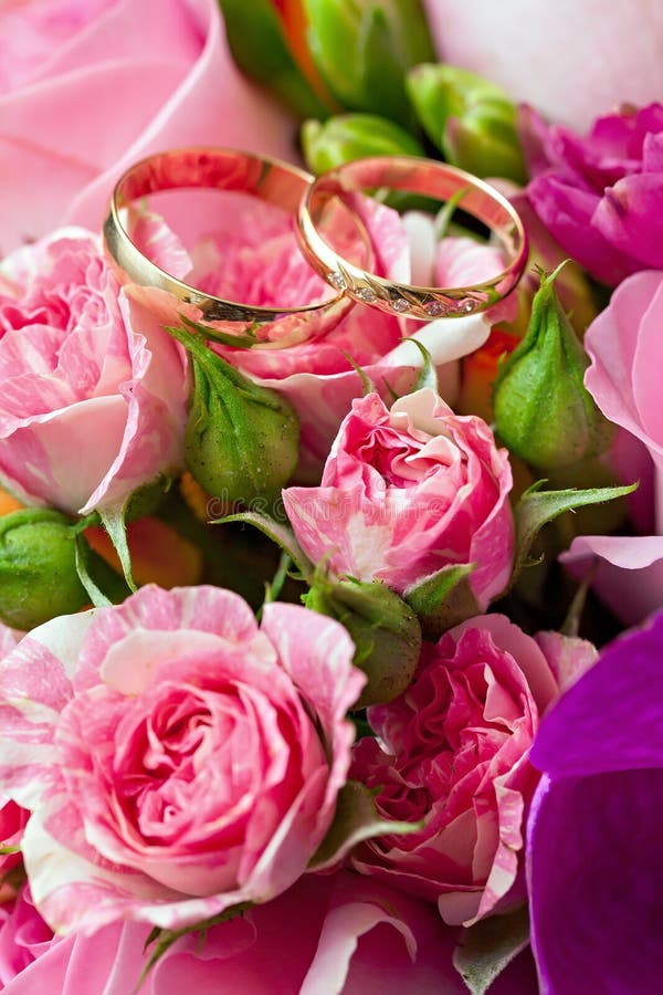 Wedding Rings of the Groom and the Bride on a Bunch of Flow Stock Image ...