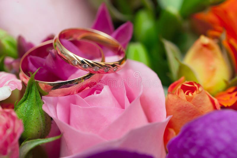 Wedding Rings of the Groom and the Bride on a Bunch of Flow Stock Photo ...