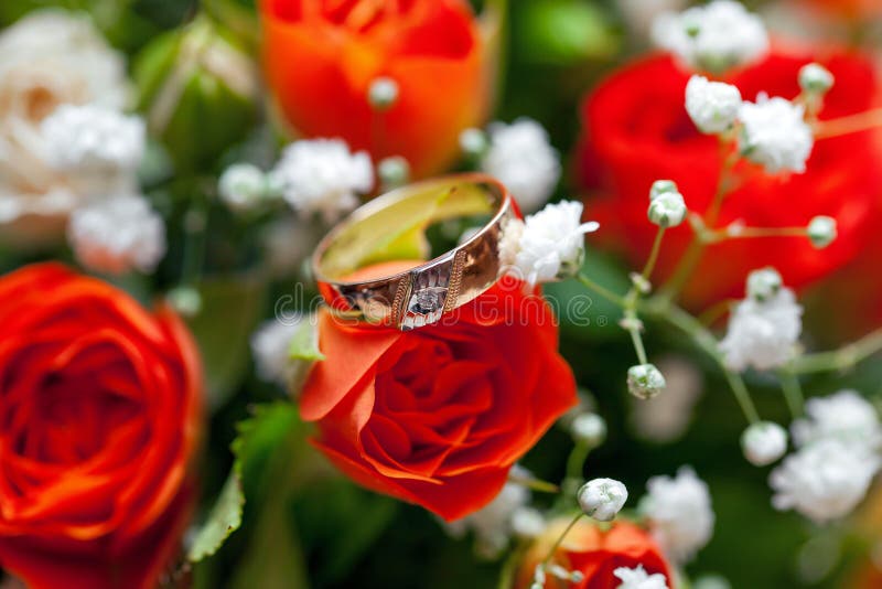 Wedding Rings of the Groom and the Bride on a Bunch of Flow Stock Photo ...