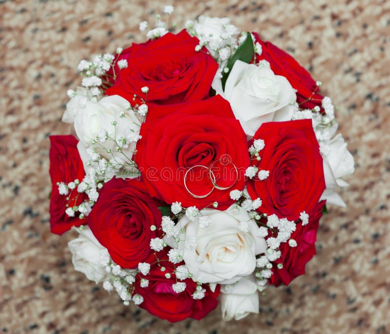 Wedding Rings of the Groom and the Bride on a Bunch of Flow Stock Image ...