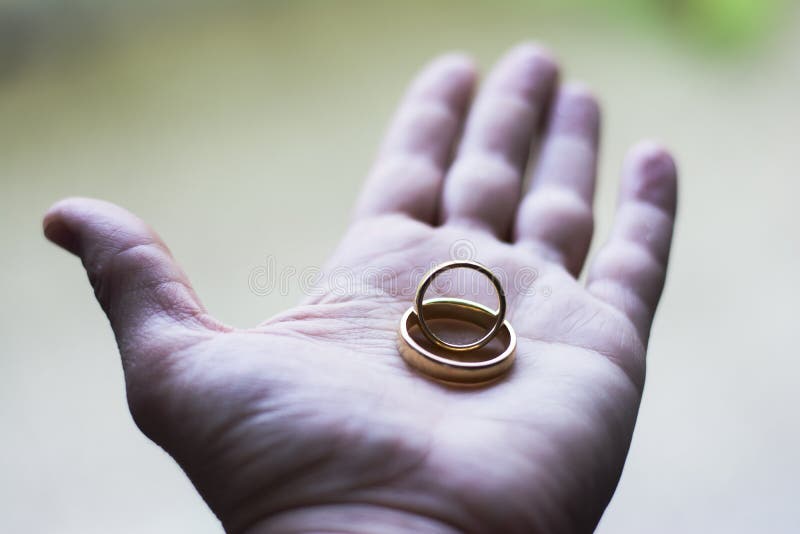 Wedding rings in hand stock image. Image of romance, invitation - 52709573