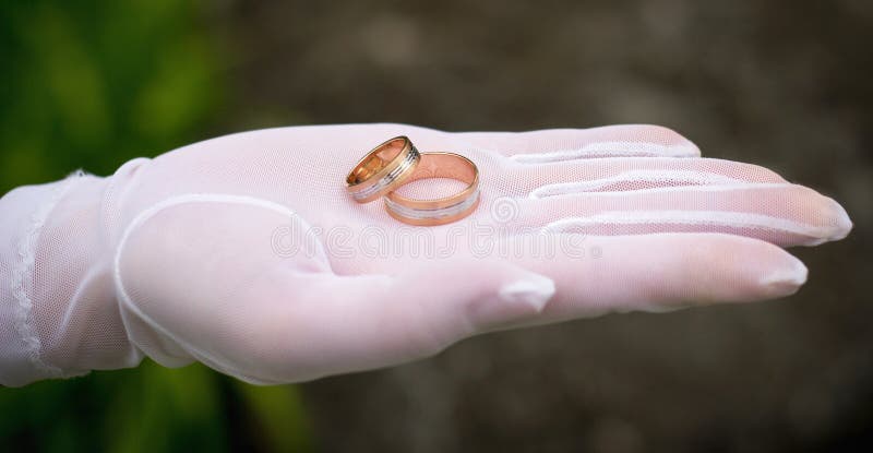 Wedding rings in a hand stock photo. Image of celebrations - 208662372