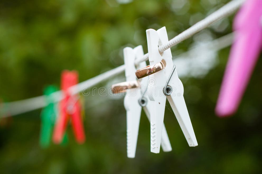 Wedding Rings Hanging on a String Stock Photo - Image of marriage ...