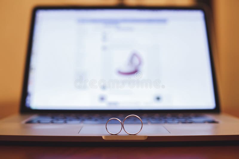 Wedding Rings on a Laptop. Computer. Wedding. Date. Social Network ...