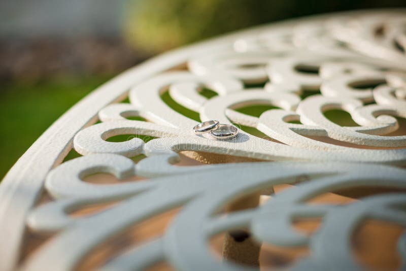 Wedding Rings Laying on the Table. Close Up Photo Stock Photo - Image ...
