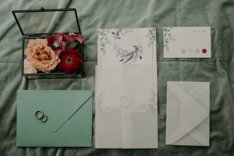 Wedding Rings Lie on an Envelope with Invitation Letters, Dress Code ...