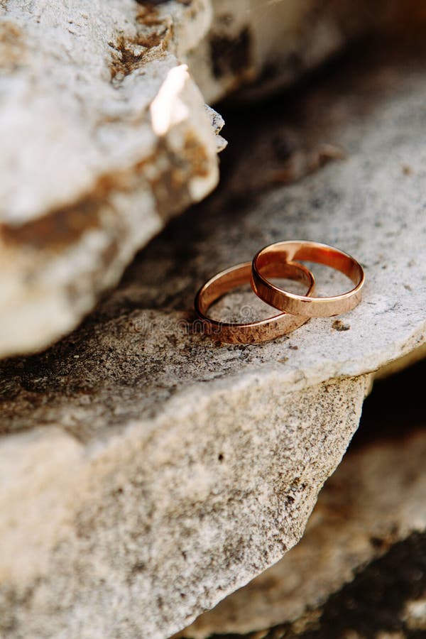 Wedding Rings Lie on the Rock. Stock Photo - Image of background ...