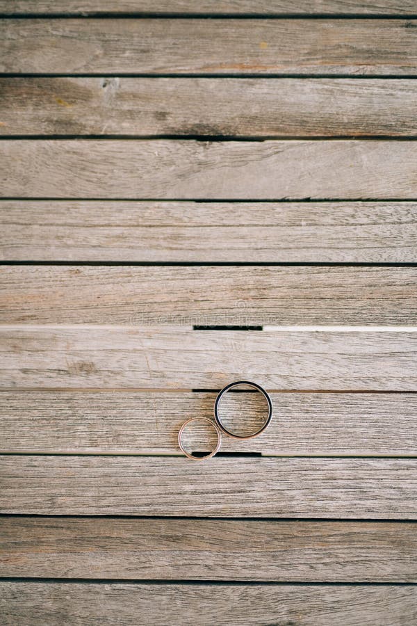 Wedding Rings on a Light Wooden Texture Stock Photo - Image of macro ...
