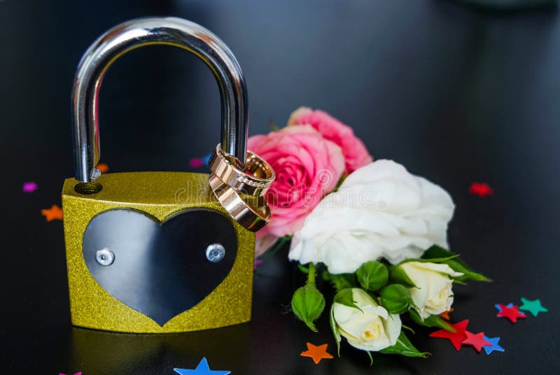 Wedding rings on a lock stock image. Image of celebration - 87370279
