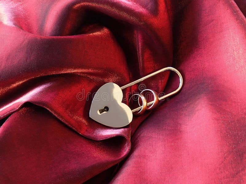 Wedding Rings in the Lock on a Red Cloth Stock Photo - Image of fashion ...