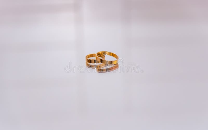 Wedding Rings on a Mirror stock photo. Image of eternity - 202411742