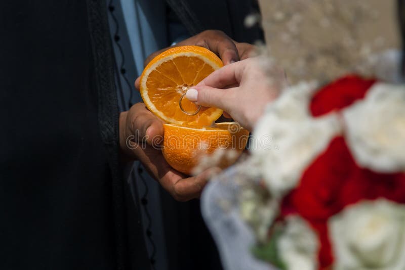 Wedding Rings in Orange, Wedding Ceremony on the Ocean Stock Image ...