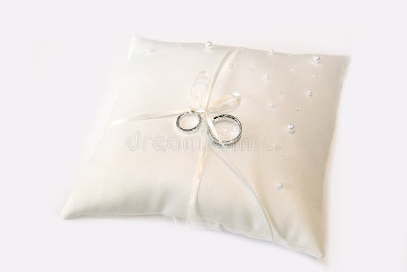 Wedding rings on a pillow stock photo. Image of couple - 10859448