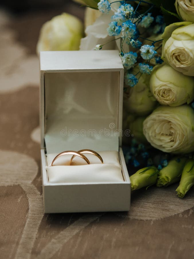 Wedding Rings with Pink Flowers on a Grey Background Stock Image ...