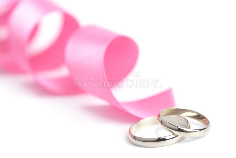 Wedding Rings and Pink Ribbon Isolated Stock Photo - Image of dress ...